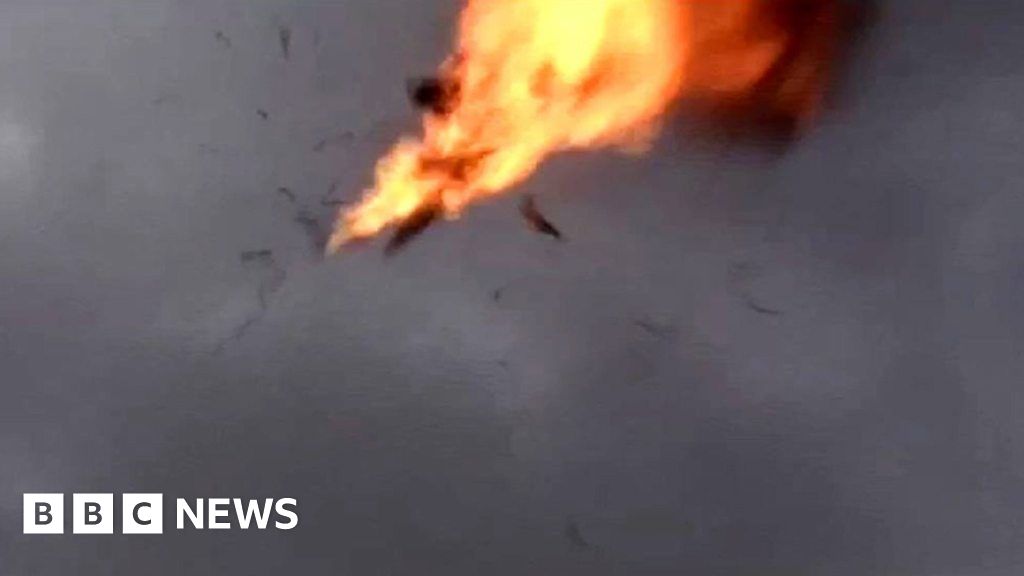 Moment Houthi drone explodes above Yemen military base - BBC News