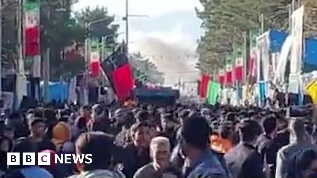 Moment crowds disperse after bomb blast near Iran general's tomb - BBC News