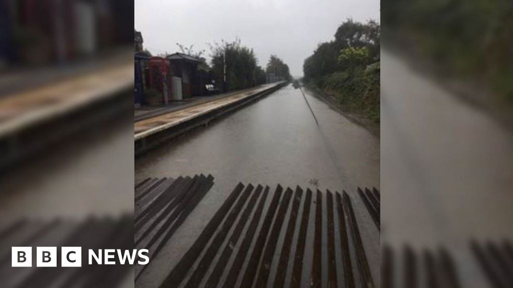 Flooded tracks cause rail travel disruption - BBC News