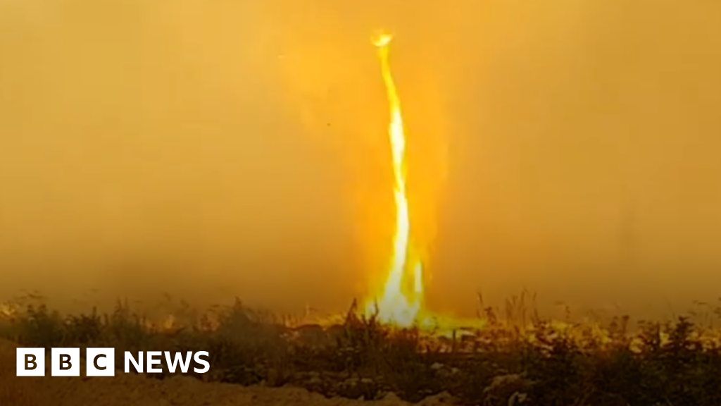 Officials watch as fiery cyclone grows over 200 ft high - BBC News