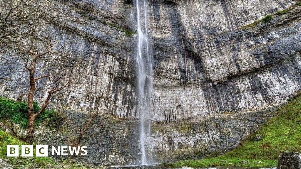 Storm Desmond: Malham Cove waterfall flows again amid heavy rain - BBC News