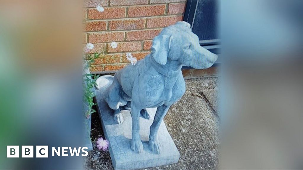 Northampton stolen dog statue is returned home - BBC News