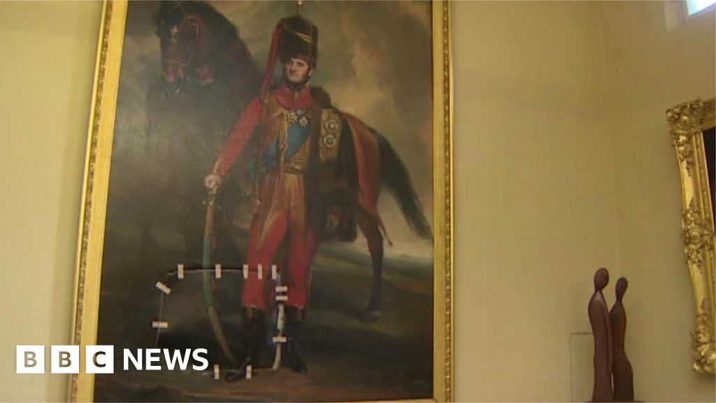 Vandals attack and slash paintings at Eye Town Hall - BBC News