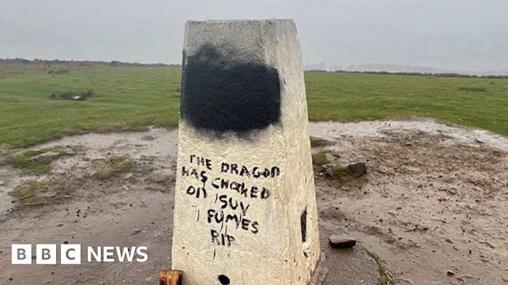 Garth Hill: Welsh dragon covered in graffiti on trig point - BBC News