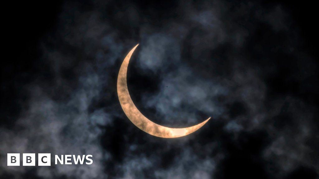 In pictures: Rare solar eclipse darkens Asia on the summer solstice ...