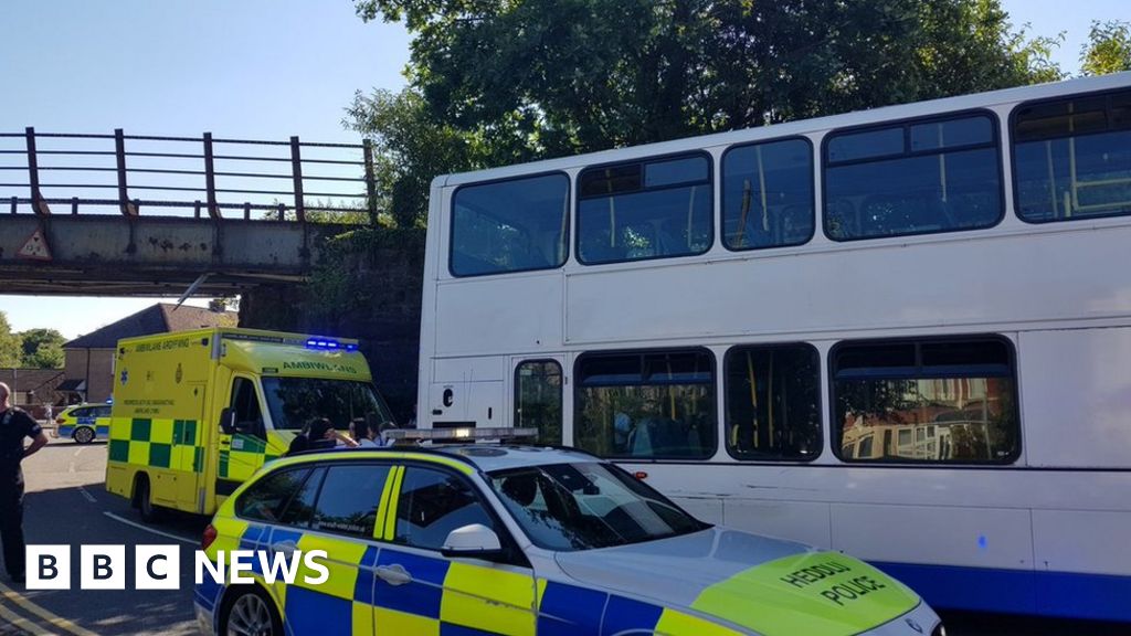One in hospital after bus crashes into bridge in Heath