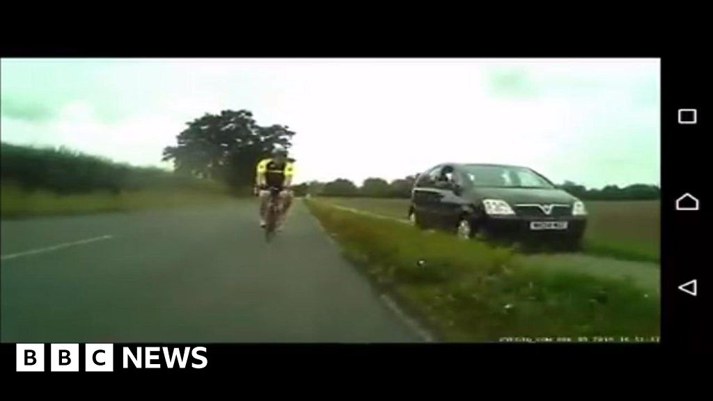 Footage shows car using path to overtake cyclists - BBC News