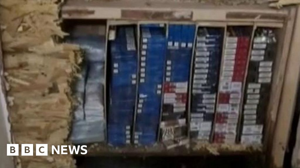Police raid finds secret lift hidden behind Bolton shop wall - BBC News