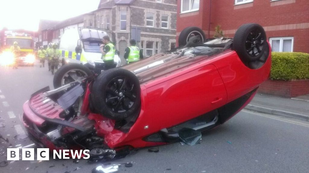 Cardiff police hunt driver of flipped car - BBC News