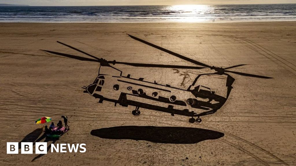 Helicopter drawn on beach highlights MoD sites danger - BBC News
