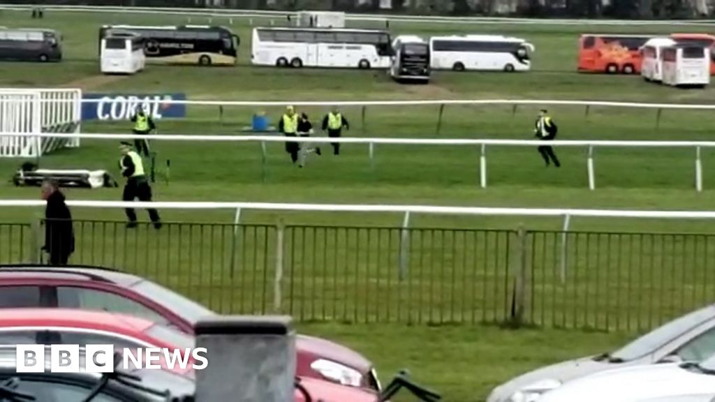 Protesters run onto Scottish Grand National course