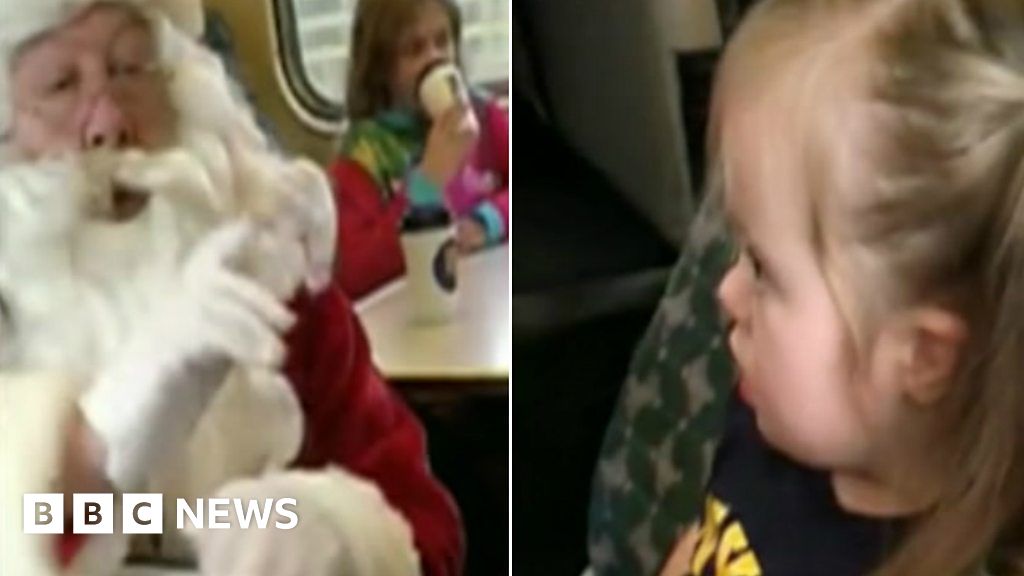 Father Christmas gives 'magical' sign language surprise - BBC News