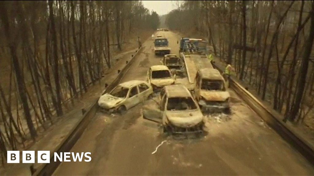 Portugal forest fire: Drone footage shows burnt-out cars - BBC News