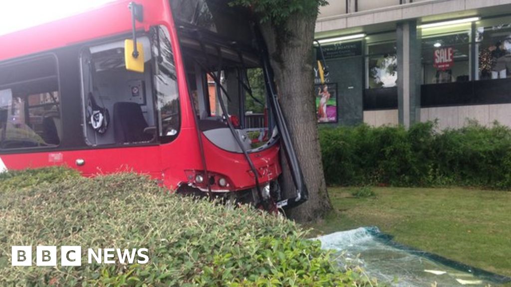 Birmingham bus collides with car then tree - BBC News