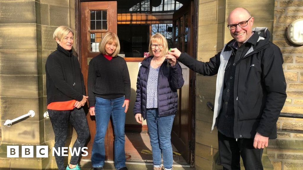 Halifax volunteers save 99-year-old library from closure - BBC News