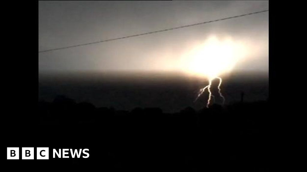 Lightning crackles as temperatures soar