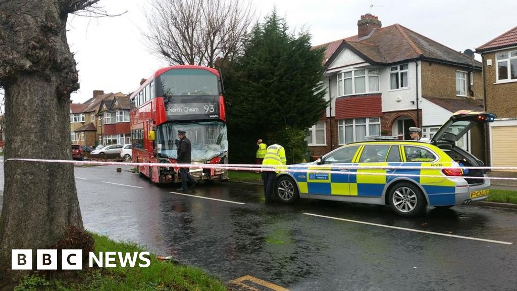 Sutton bus crash: Out-of-control bus hits cars and gardens - BBC News