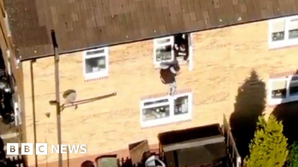 Drone footage shows man jumping from window in Matlock drug raid - BBC News
