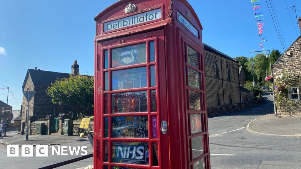 Derbyshire villagers get creative with red telephone boxes - BBC News