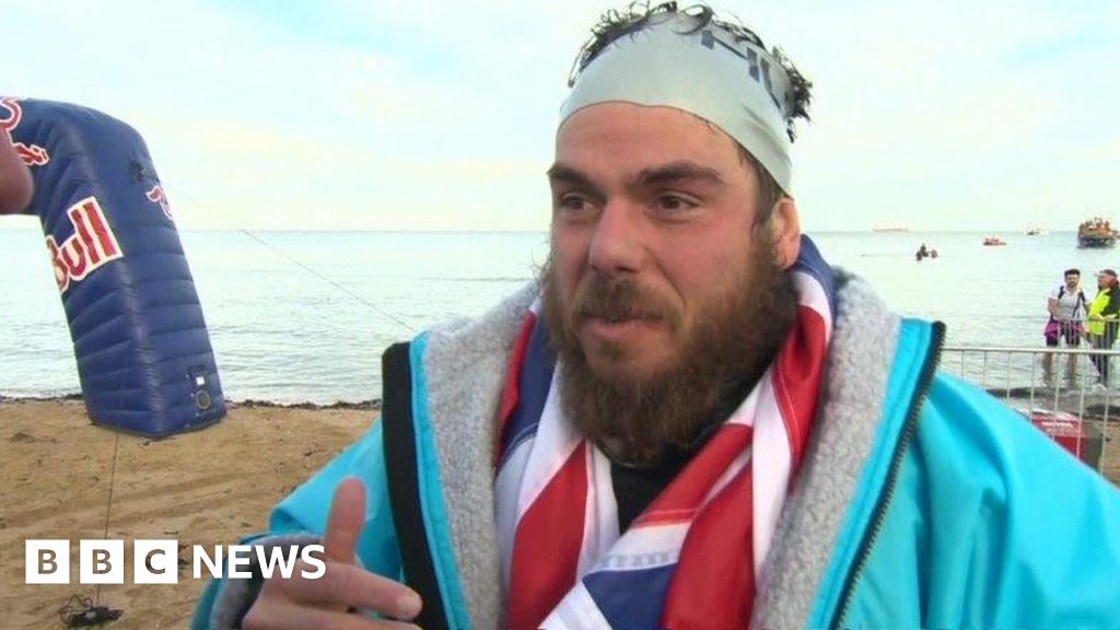 Ross Edgley sets record for round Great Britain swim - BBC News