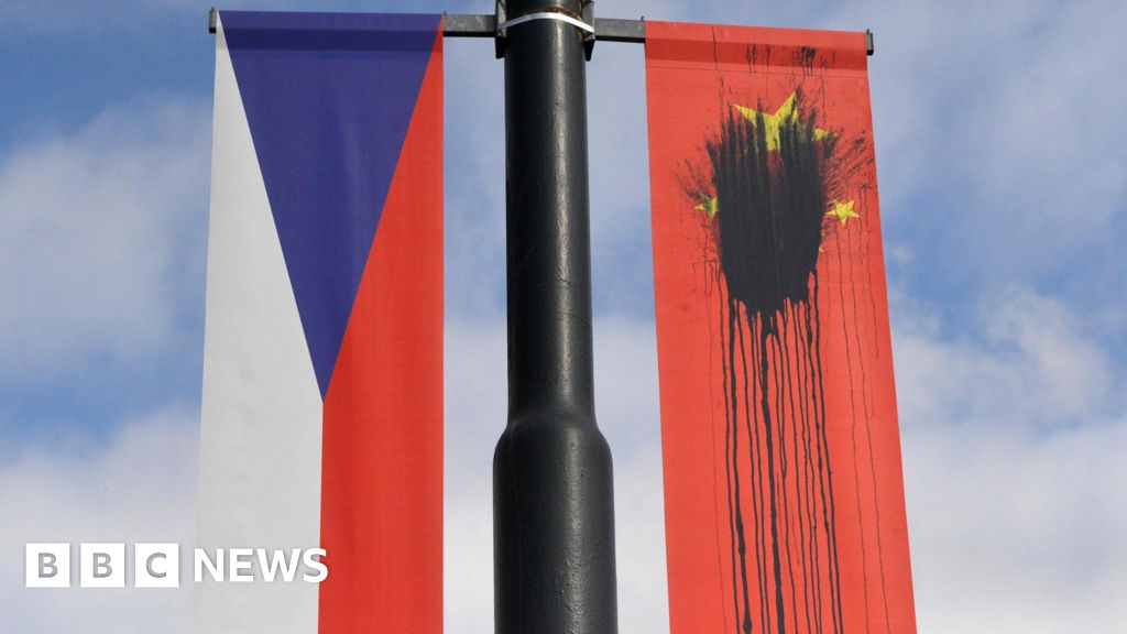 Chinese flags defaced in Prague ahead of Xi visit - BBC News