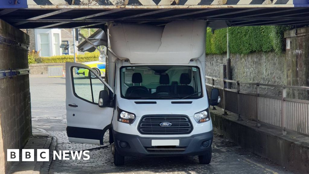 Van driver reported after railway bridge crash - BBC News