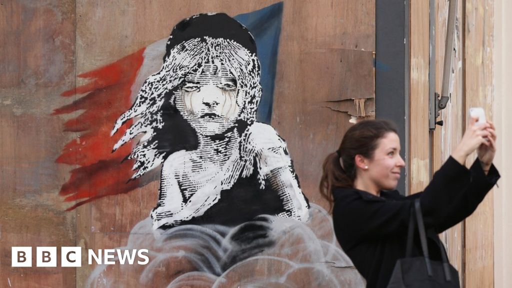 Banksy's Calais 'Jungle' teargas mural boarded up by building firm ...
