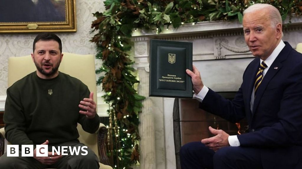 Zelensky hands medal from Himars soldier to US president - BBC News