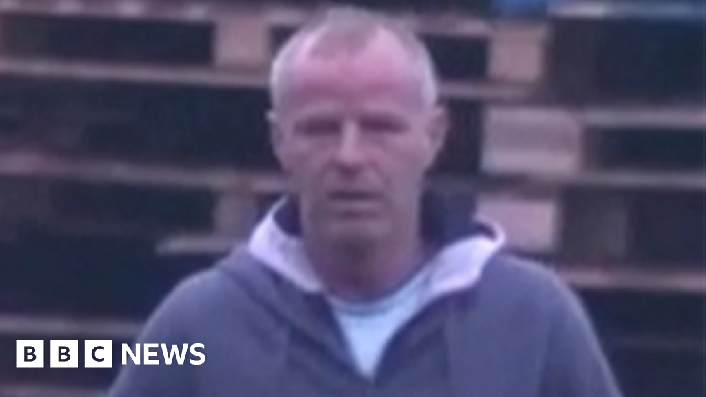 Avoniel bonfire: Image released of man sought by police - BBC News