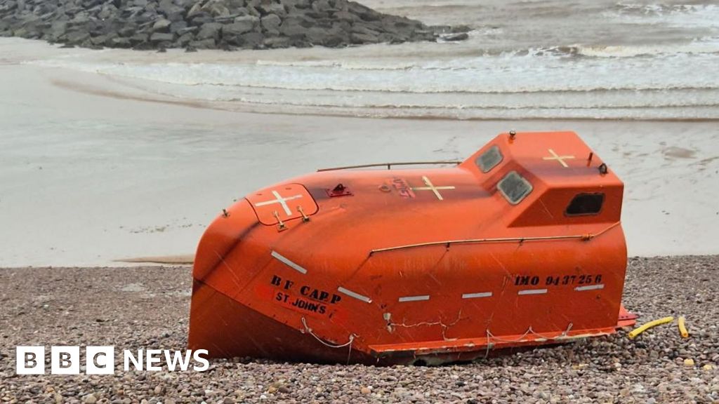 Missing lifeboat washes up on Devon beach - BBC News