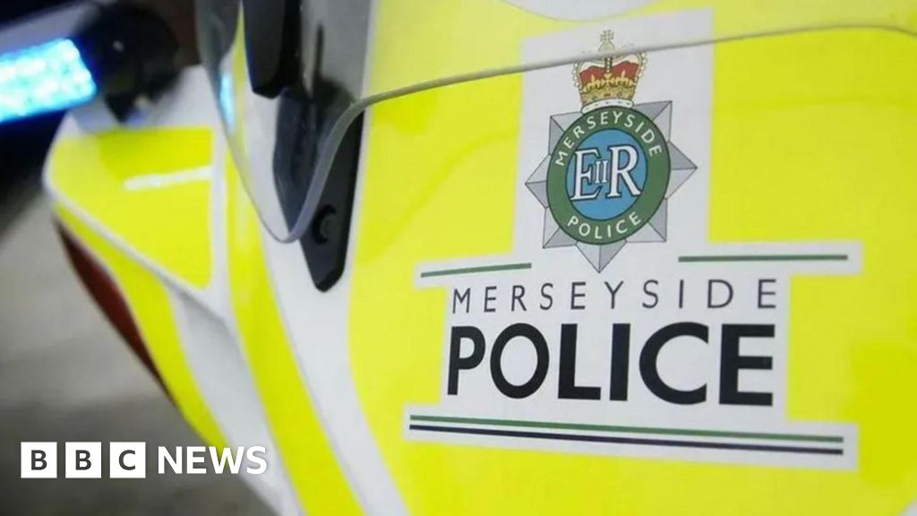 Liverpool: Armed police shoot out taxi tyres in hunt for man