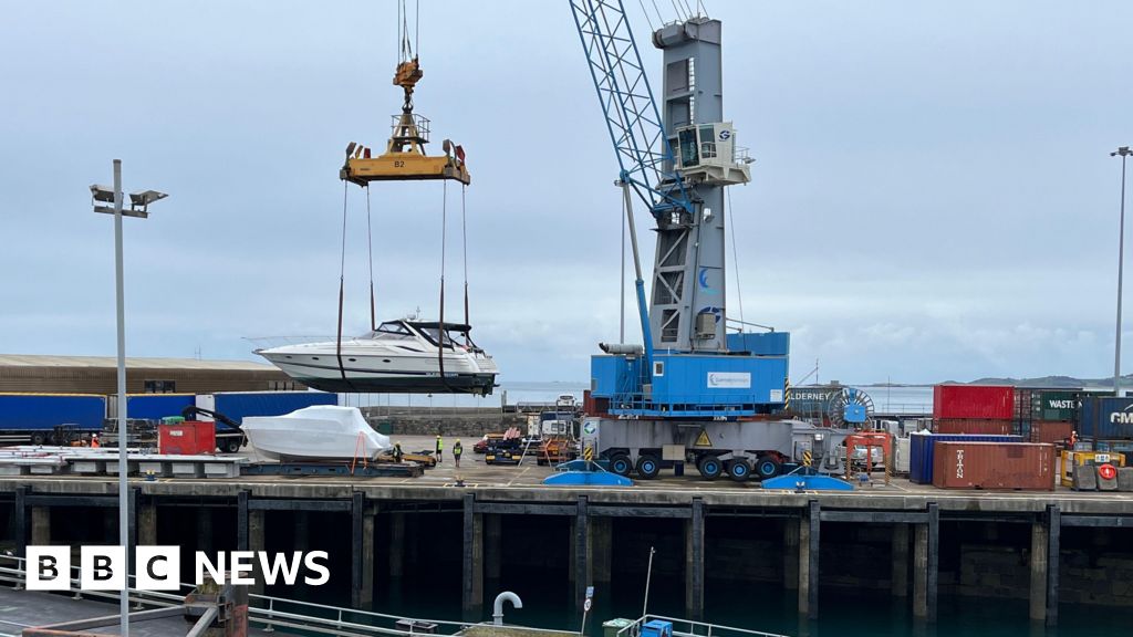Parking to reopen after boats lifted into marina - BBC News