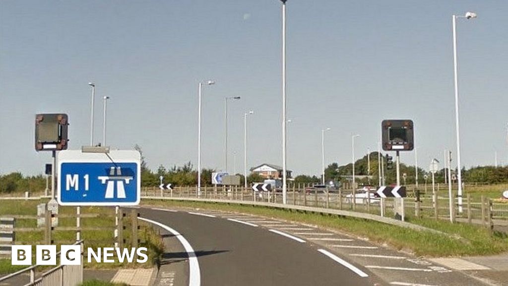 Man, 19, hit by truck on M1 near Garforth dies - BBC News