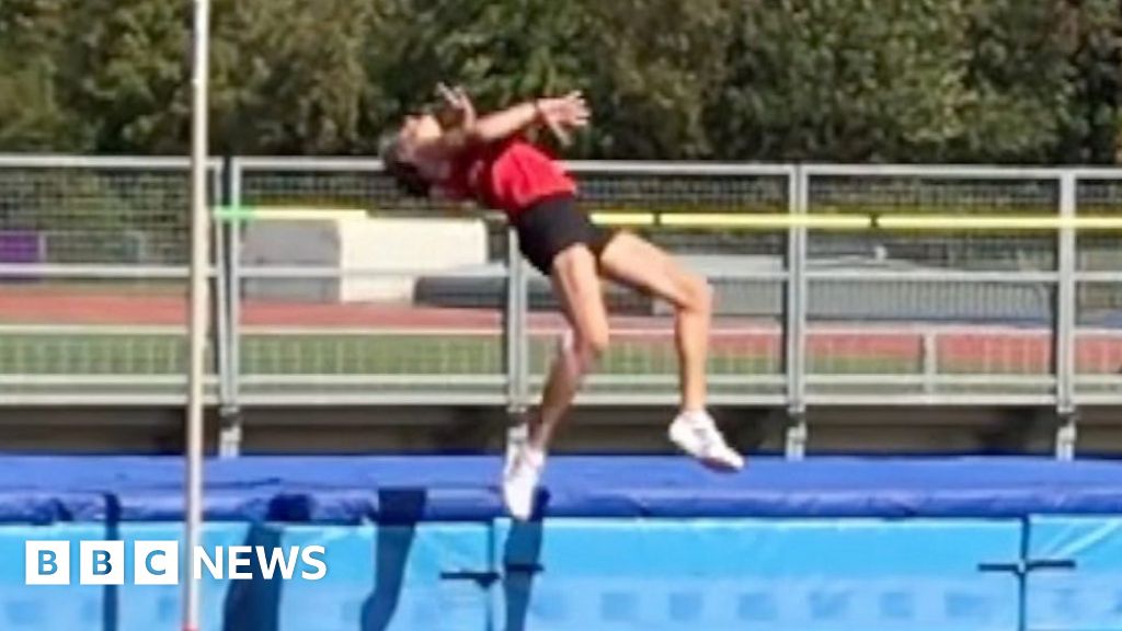 PE teacher sets Over-50s high jump record - BBC News