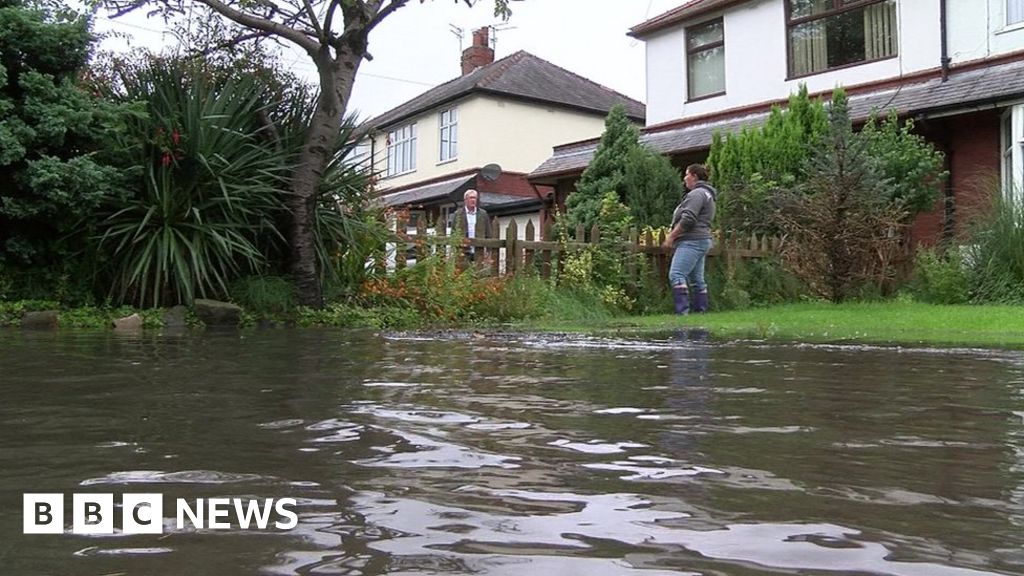 Lancashire villagers build flood defence dam after funding snub - BBC News