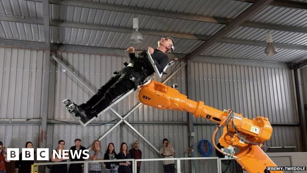 Perth professor gyrates on huge robotic arm - BBC News