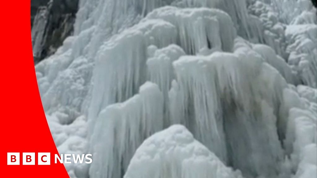 Waterfall in Ukraine completely freezes - BBC News