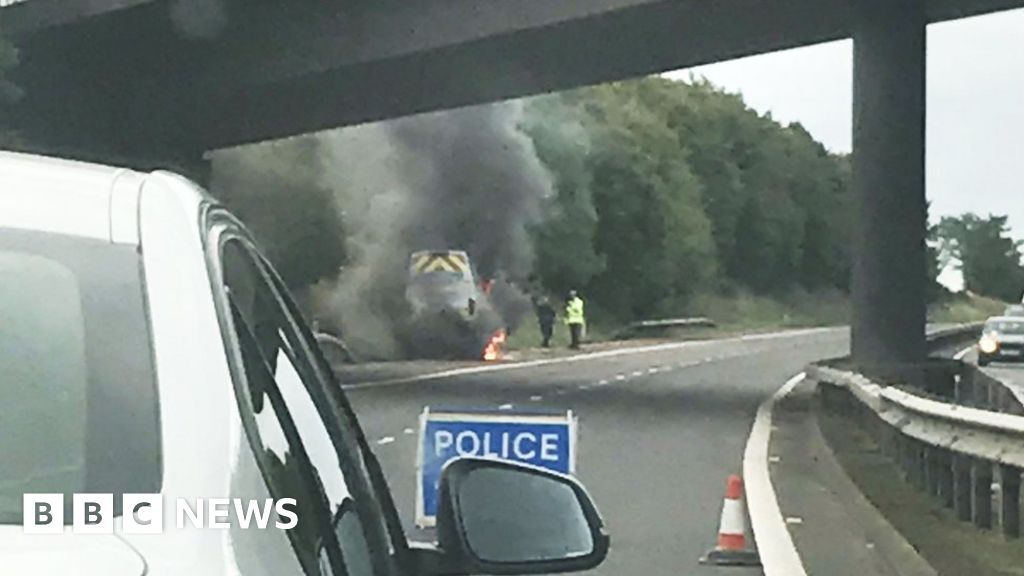 Van on fire causes rush hour delays on M90 - BBC News