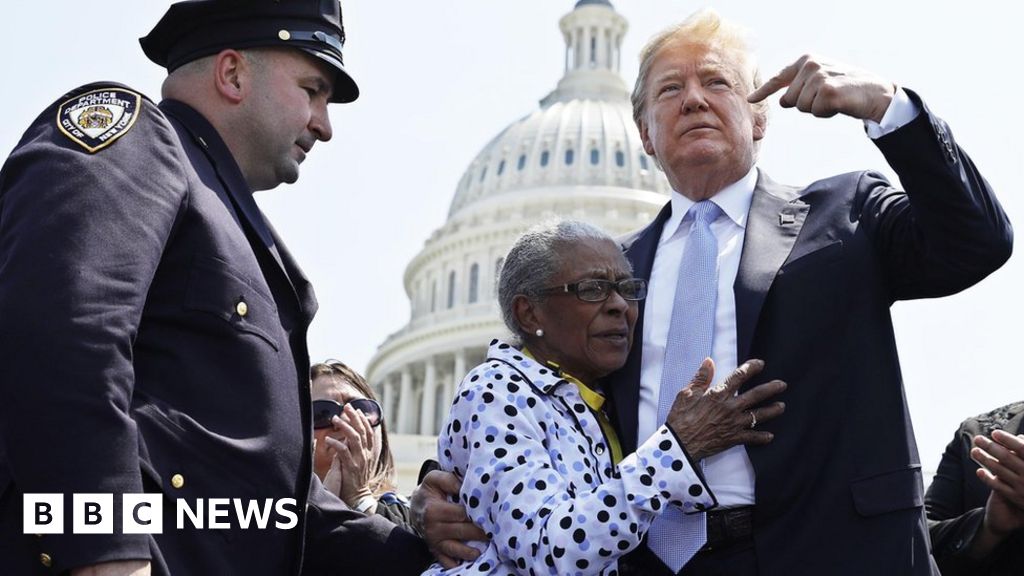 Trump consoles slain police officer's family - BBC News