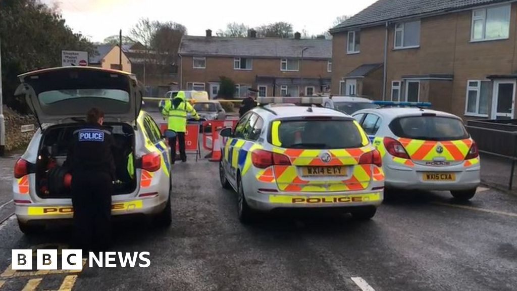 Shots fired in Castle Cary as police surround robbery suspect - BBC News