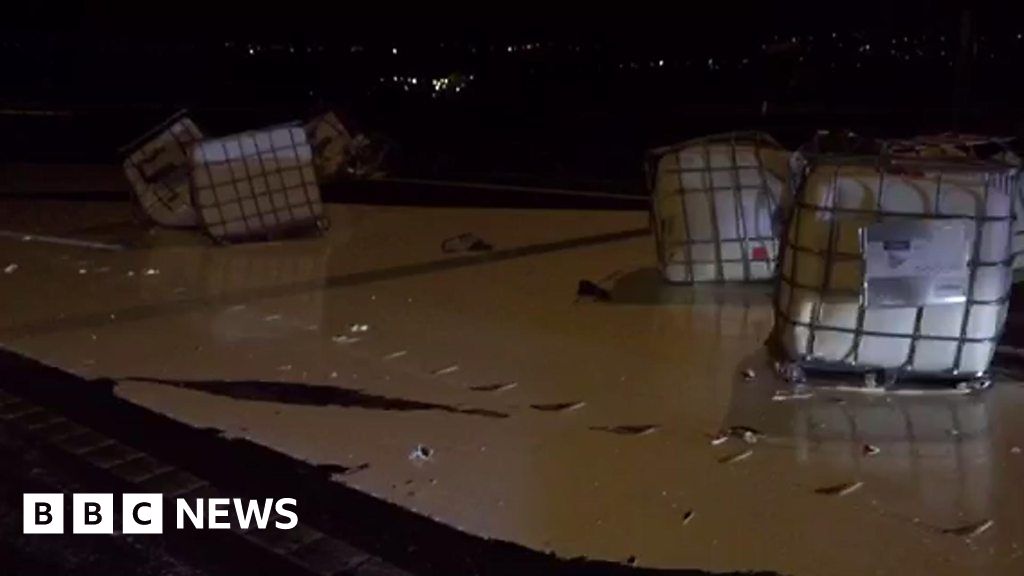 Lorry crash spills paint over M606 motorway - BBC News