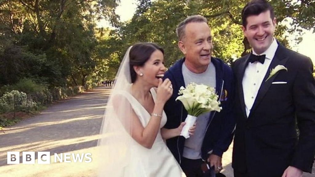Couple describe moment Hanks photobombed wedding pictures - BBC News