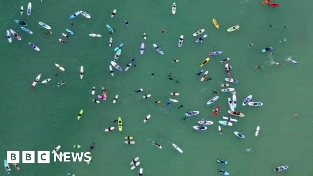 Hundreds in Devon and Cornwall join paddle out sewage protests