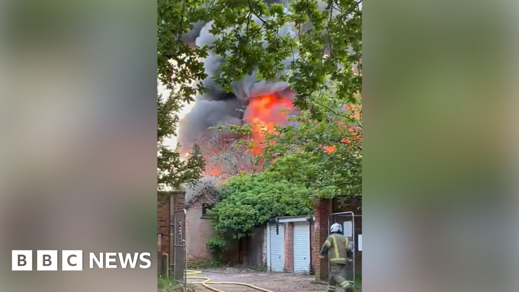 Flames and thick smoke billow at 'very large fire' in Hertford - BBC News