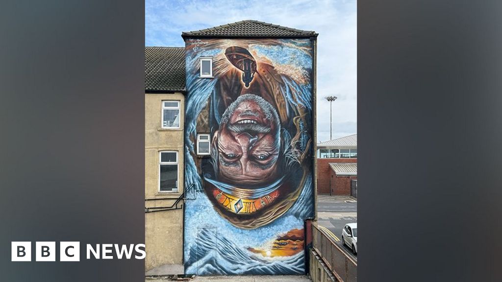 Upside down fisherman mural leaves Fleetwood community baffled - BBC News