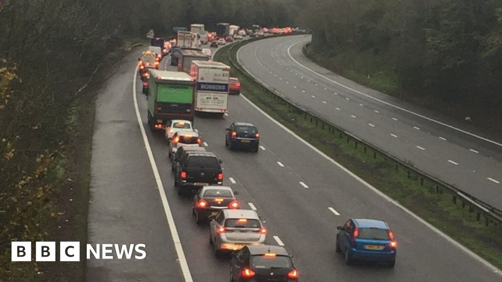 M4 reopens after crash leaves motorcyclist critical - BBC News