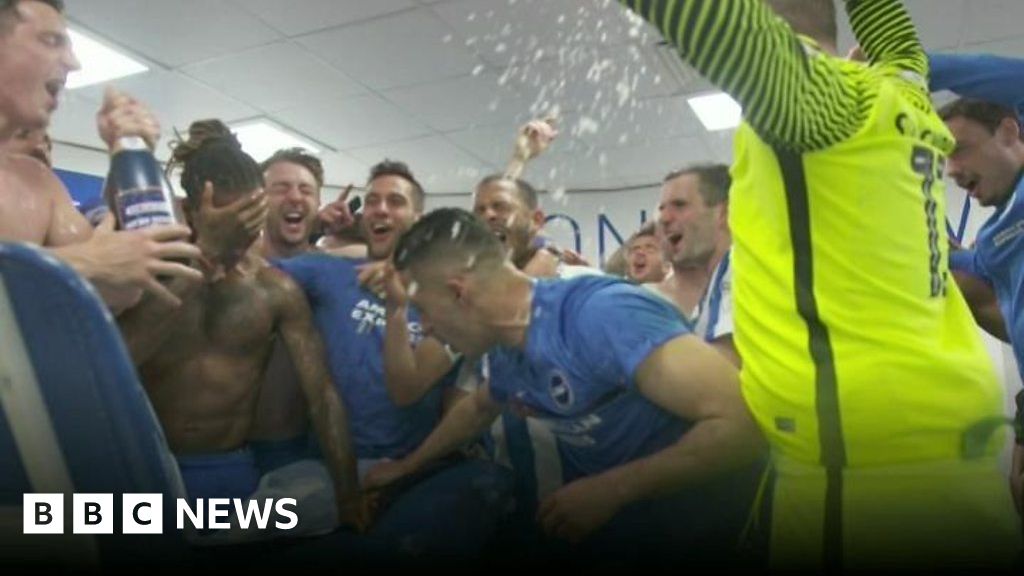 Brighton players and fans celebrate promotion - BBC News