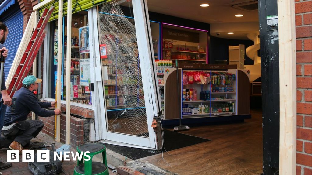 West Belfast shops damaged by stolen car on Falls Road - BBC News