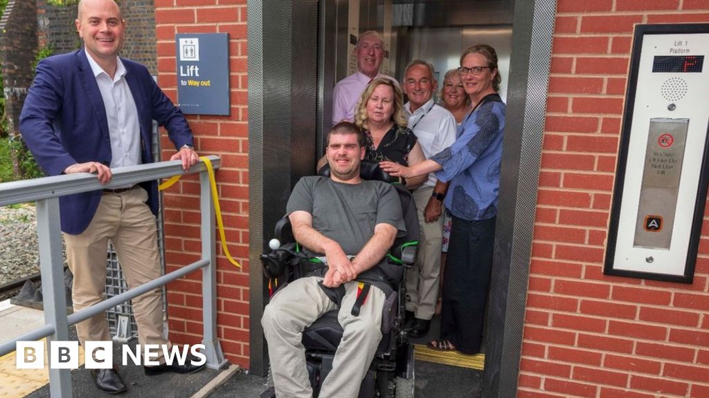 Wheelchair user celebrates new lift at Birkenhead Park station