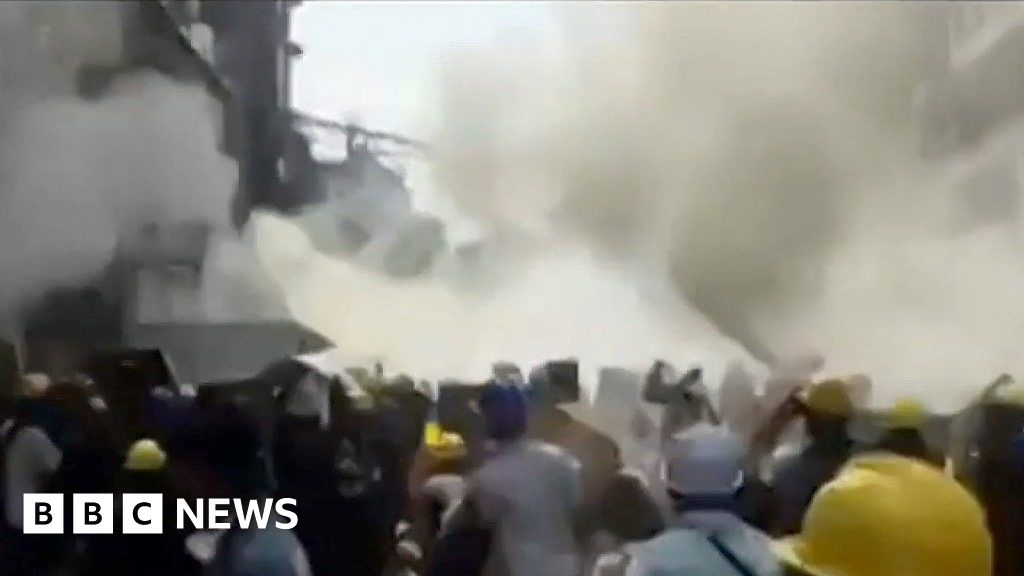 Myanmar anti-coup protesters flee from tear gas - BBC News